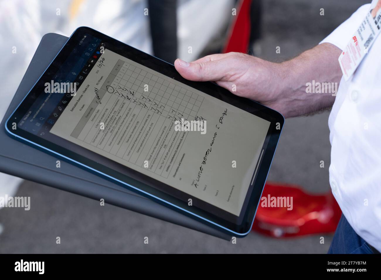 An FIA official judges the extrication team carrying out training to ...