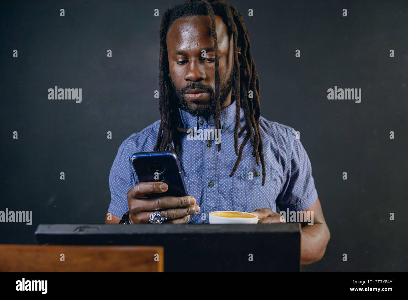 African black man with dreadlocks and beard, self-employed, standing ...