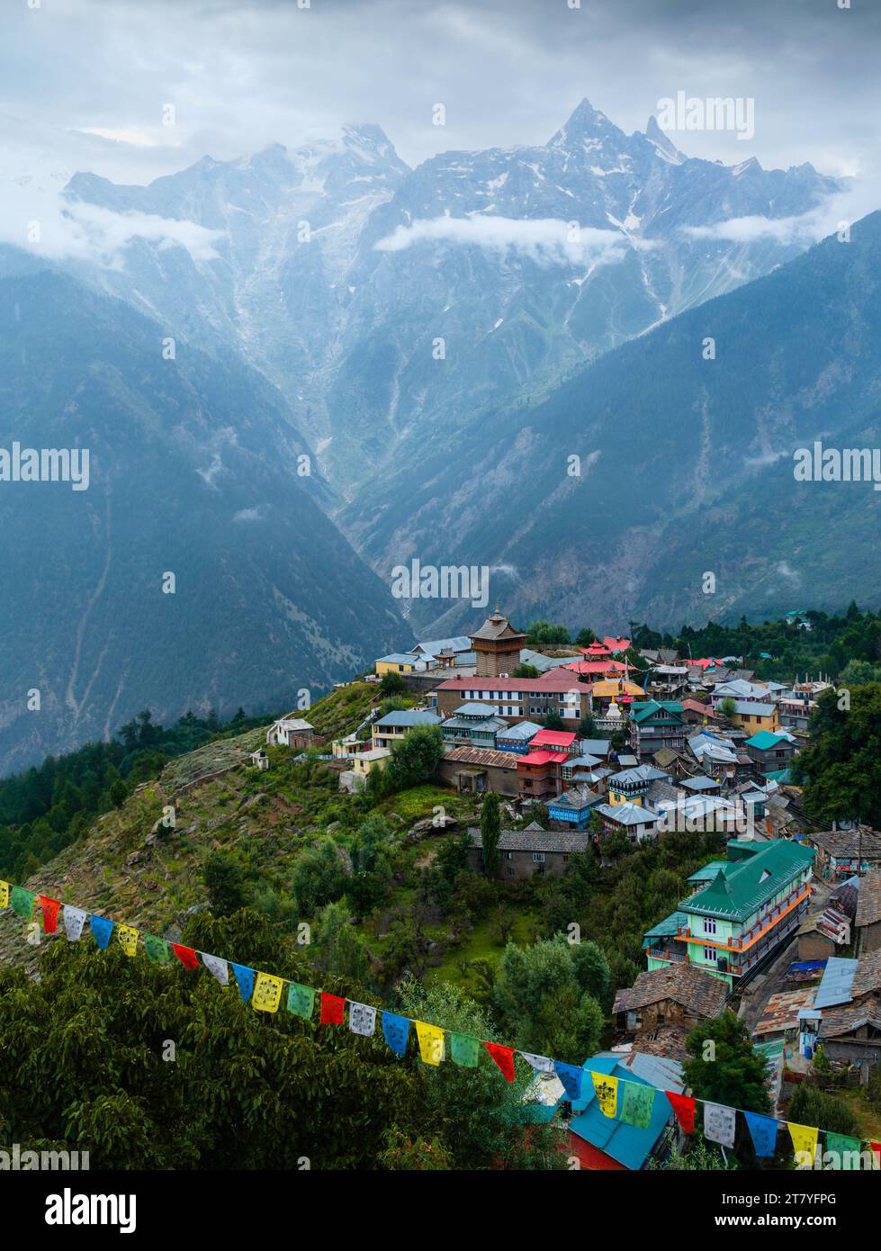 Kalpa village nestled in valley flanked by Himalayas shrouded in mist ...