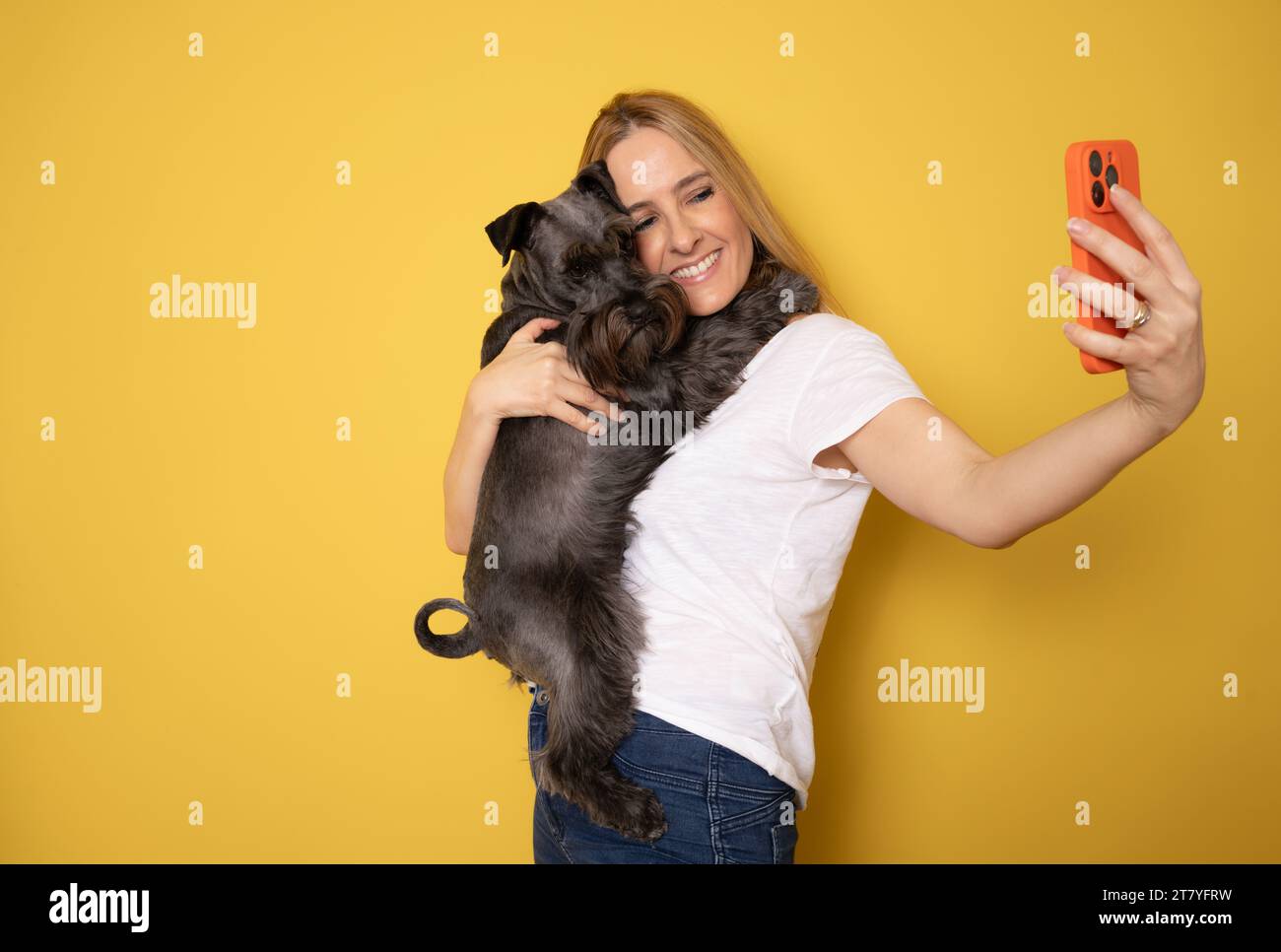 Friendship concept. Happy european woman taking selfie with her cute ...