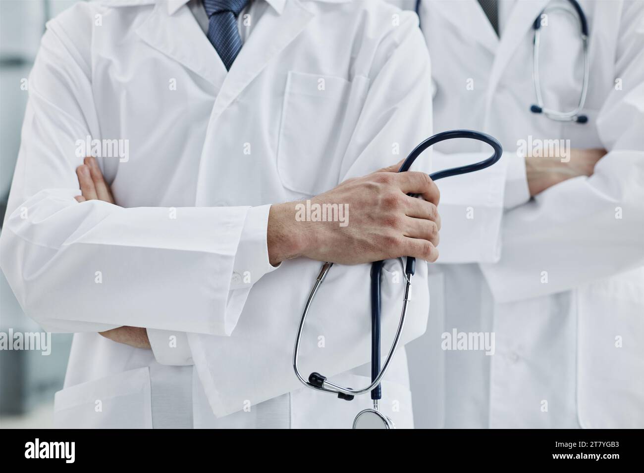 Close up of male medicine therapeutist doctor hands crossed on his ...