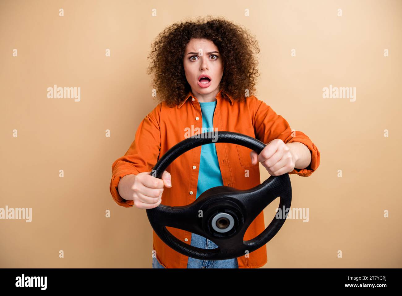 Photo of shocked upset girl wear stylish orange clothes drive car road ...