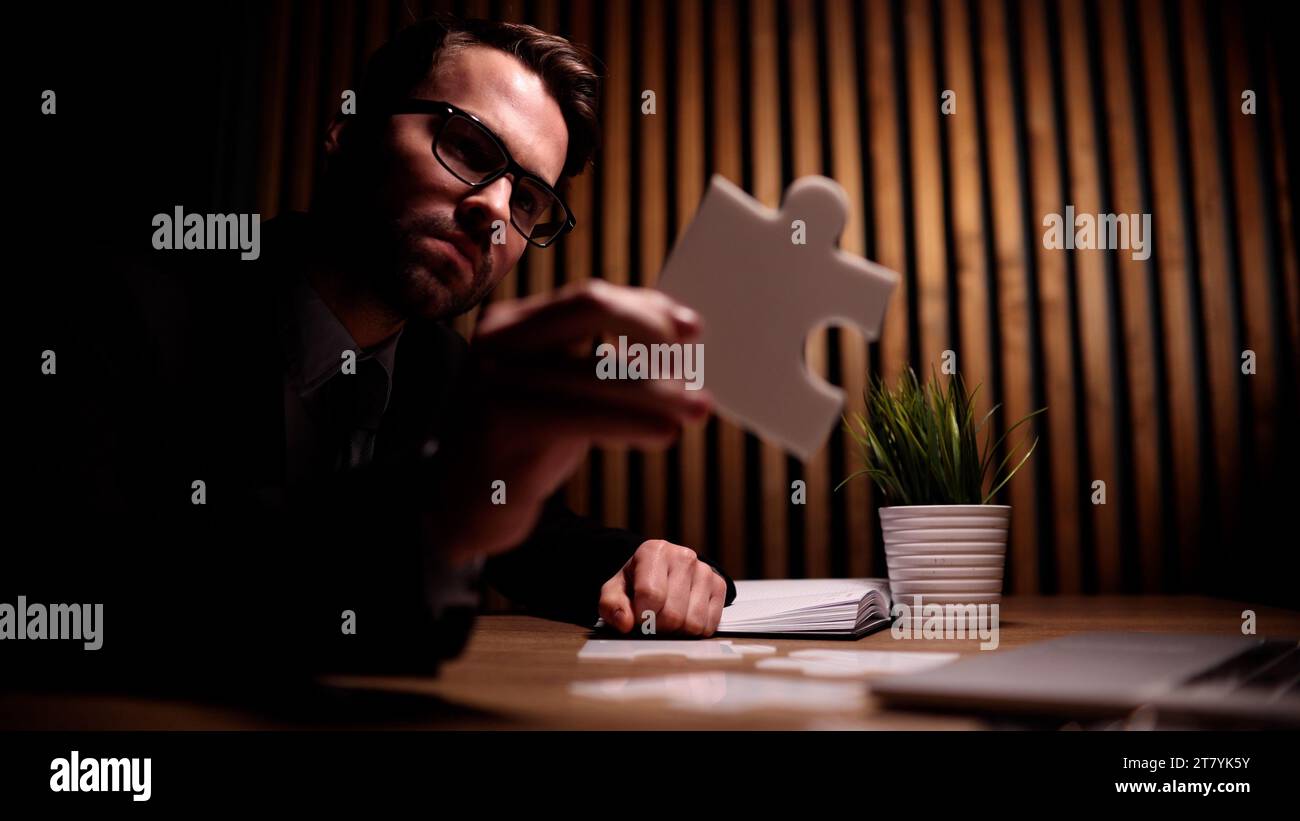 Attractive young guy is solving a problem Stock Photo - Alamy