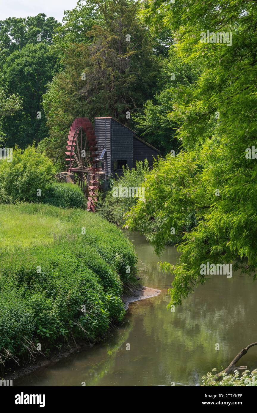 The restored and working iron waterwheel on the River Mole at Painshill ...