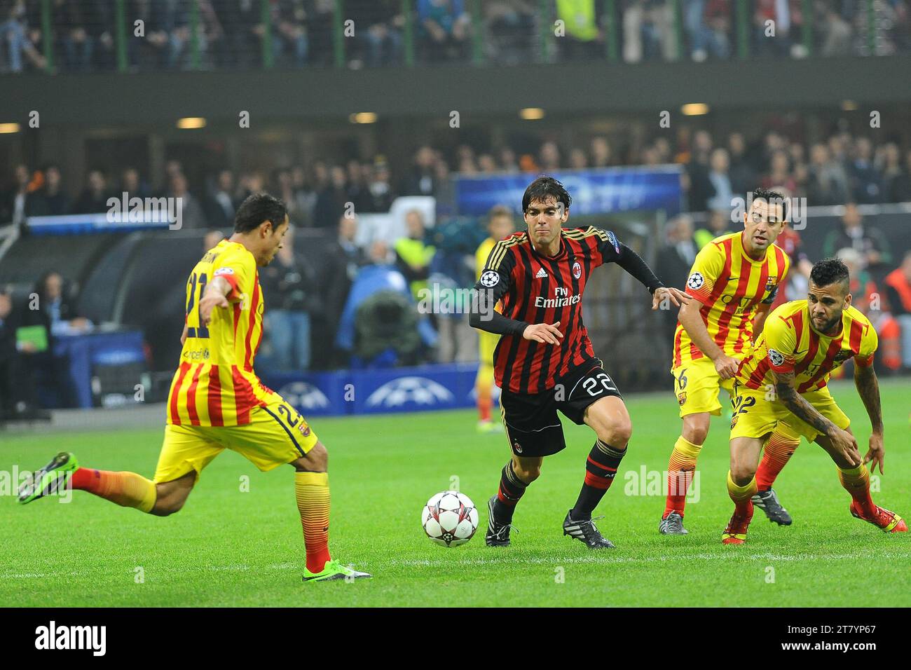 Kaka of AC Milan surrounded by players of FC Barcelona during the UEFA ...