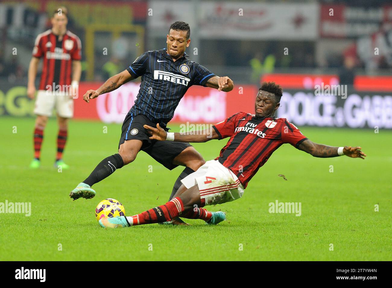 Fredy Guarin of FC Inter Milan is tackled by Sulley Ali Muntari of AC ...