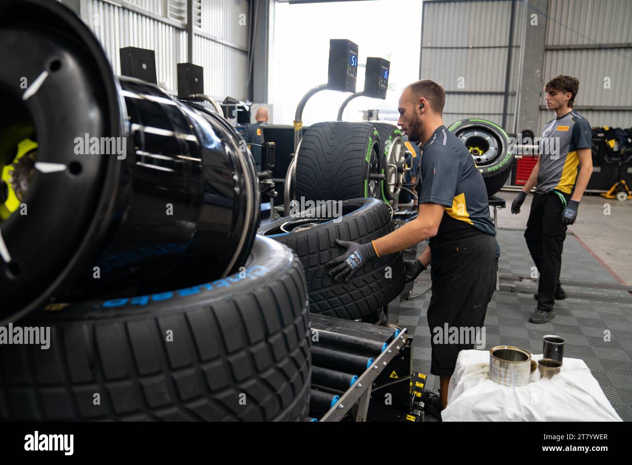 Pirelli’s fitters attach the wheels to the designated tyres for each ...