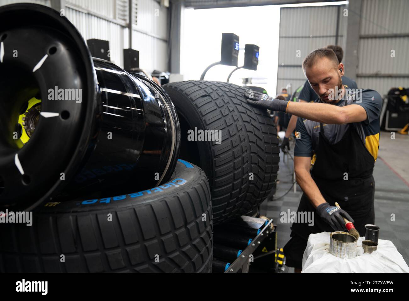 Pirelli’s fitters use glue to attach the tyre to the team's wheel ...