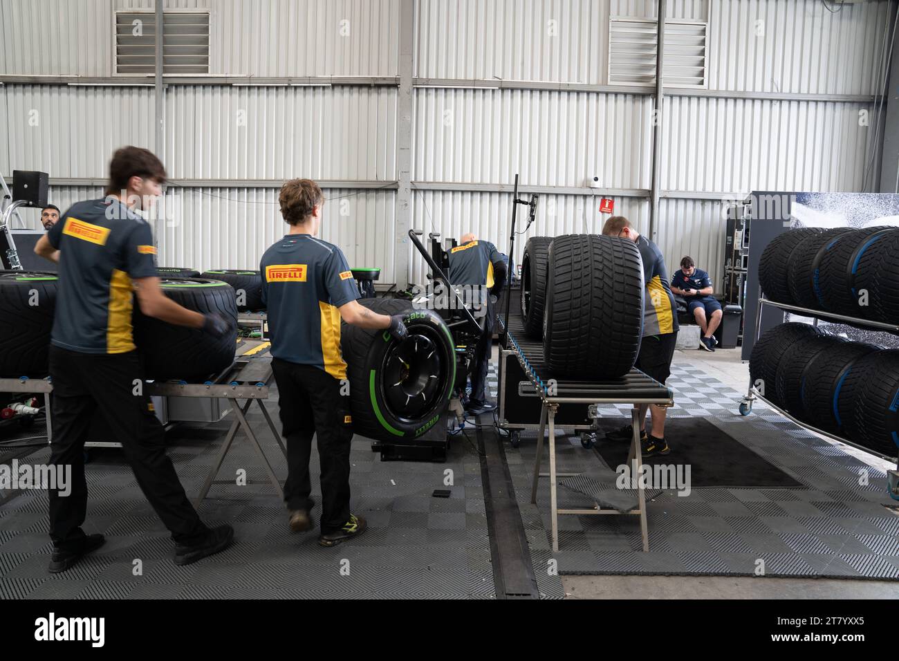Pirelli’s fitters attach the wheels to the designated tyres for each ...
