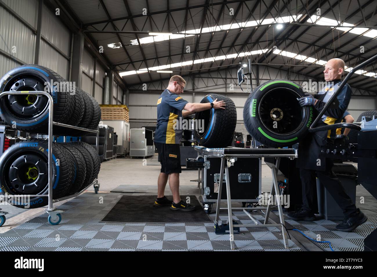 Pirelli’s fitters attach the wheels to the designated tyres for each ...