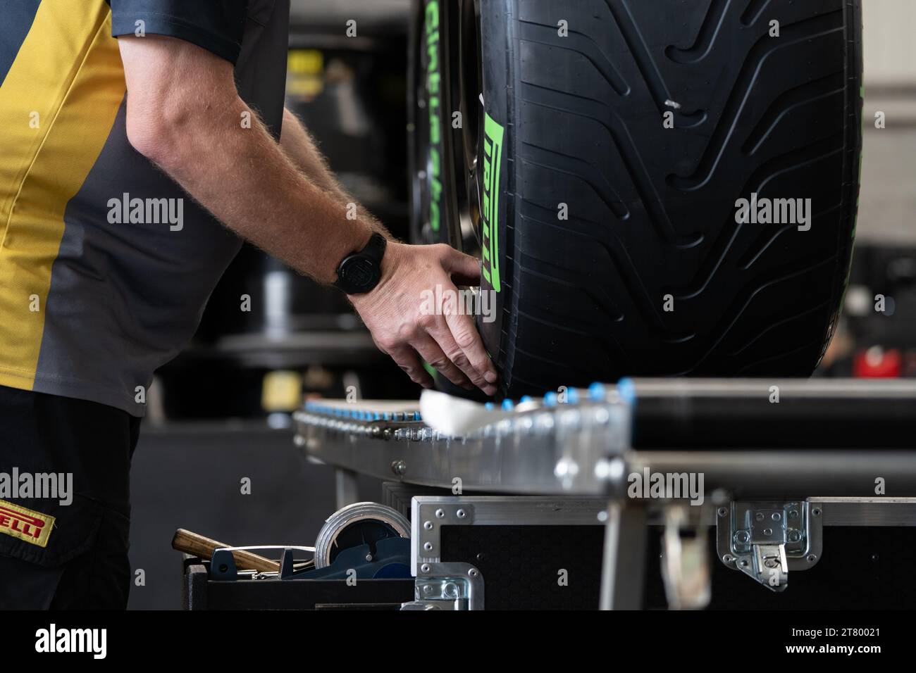 Pirelli’s fitters attach the wheels to the designated tyres for each ...