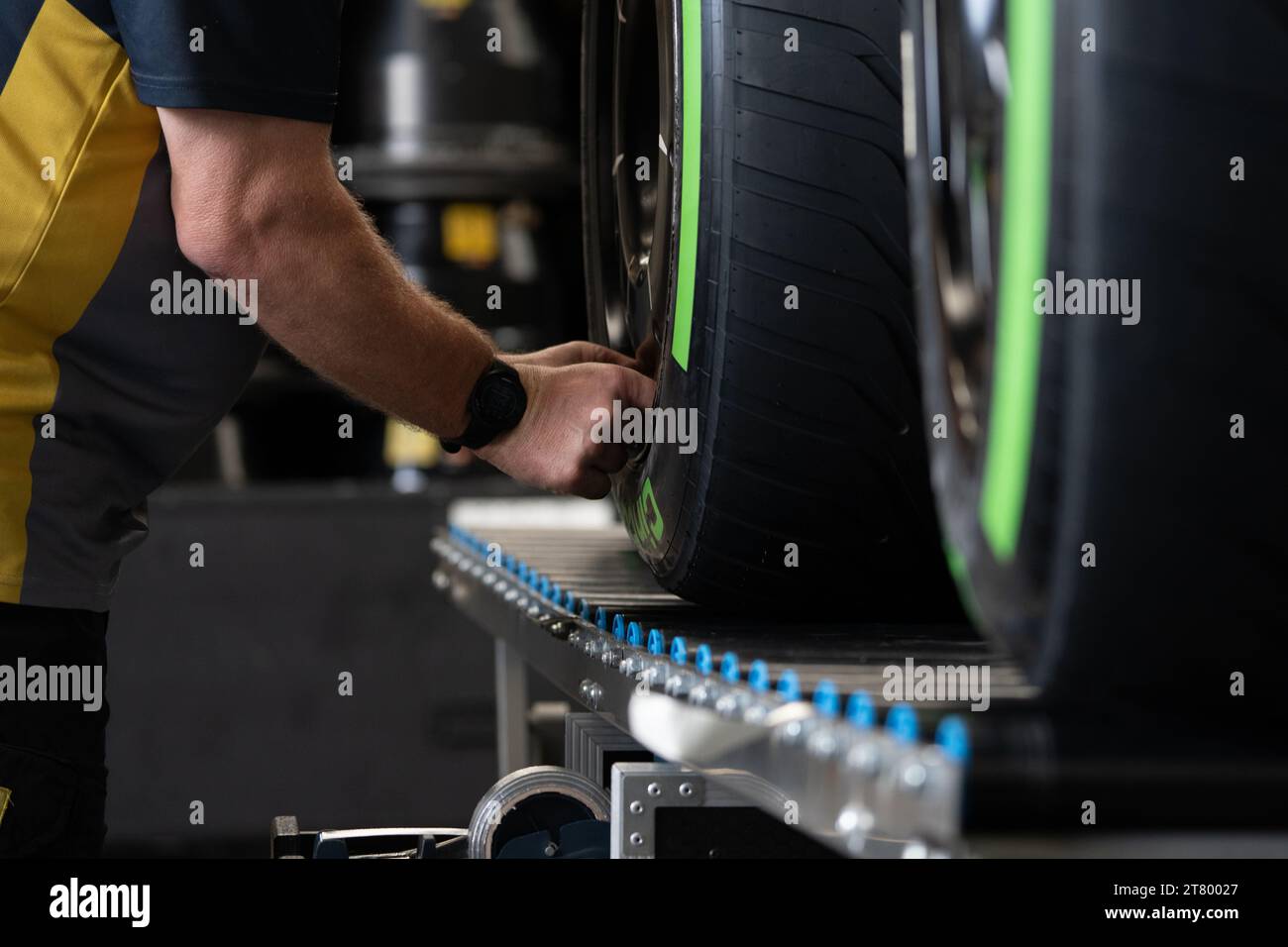 Pirelli’s fitters attach the wheels to the designated tyres for each ...