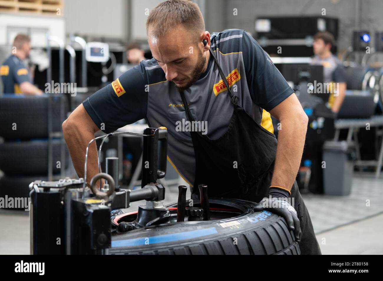Pirelli’s fitters attach the wheels to the designated tyres for each ...