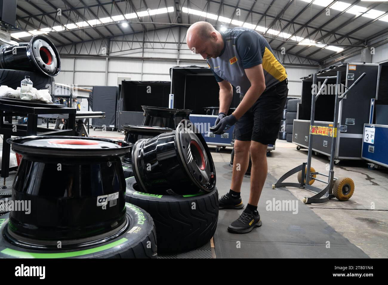 Pirelli’s fitters attach the wheels to the designated tyres for each ...