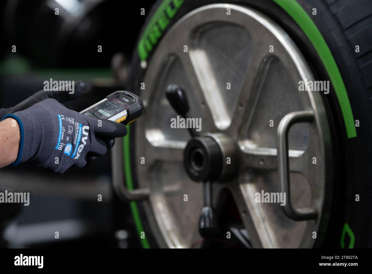 Pirelli’s fitters attach the wheels to the designated tyres for each ...