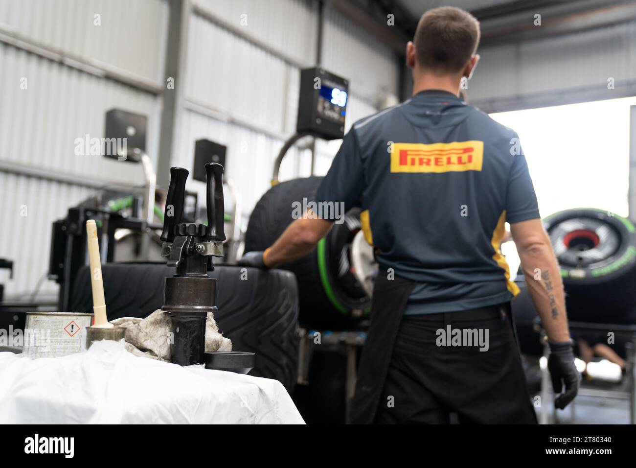 Pirelli’s fitters use glue to attach the tyre to the team's wheel ...