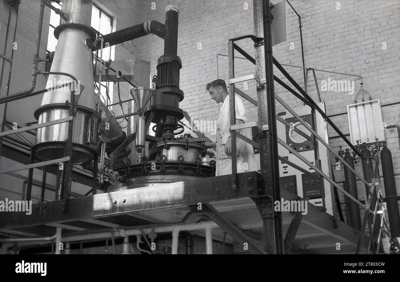 1960s, historical, a male operative, in dirty working overalls ...