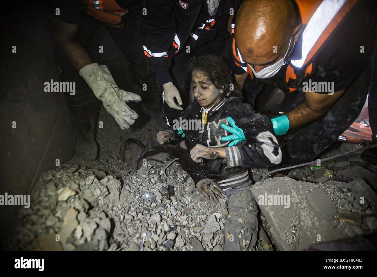 A Palestinian girl and her mother emerge from under the rubble in Khan ...