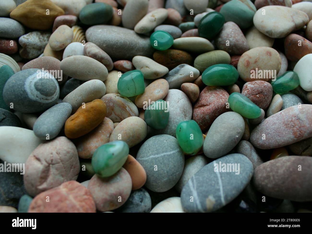 Green Minerals On A Colored Pebble Stones With Quartz Veins Texture ...
