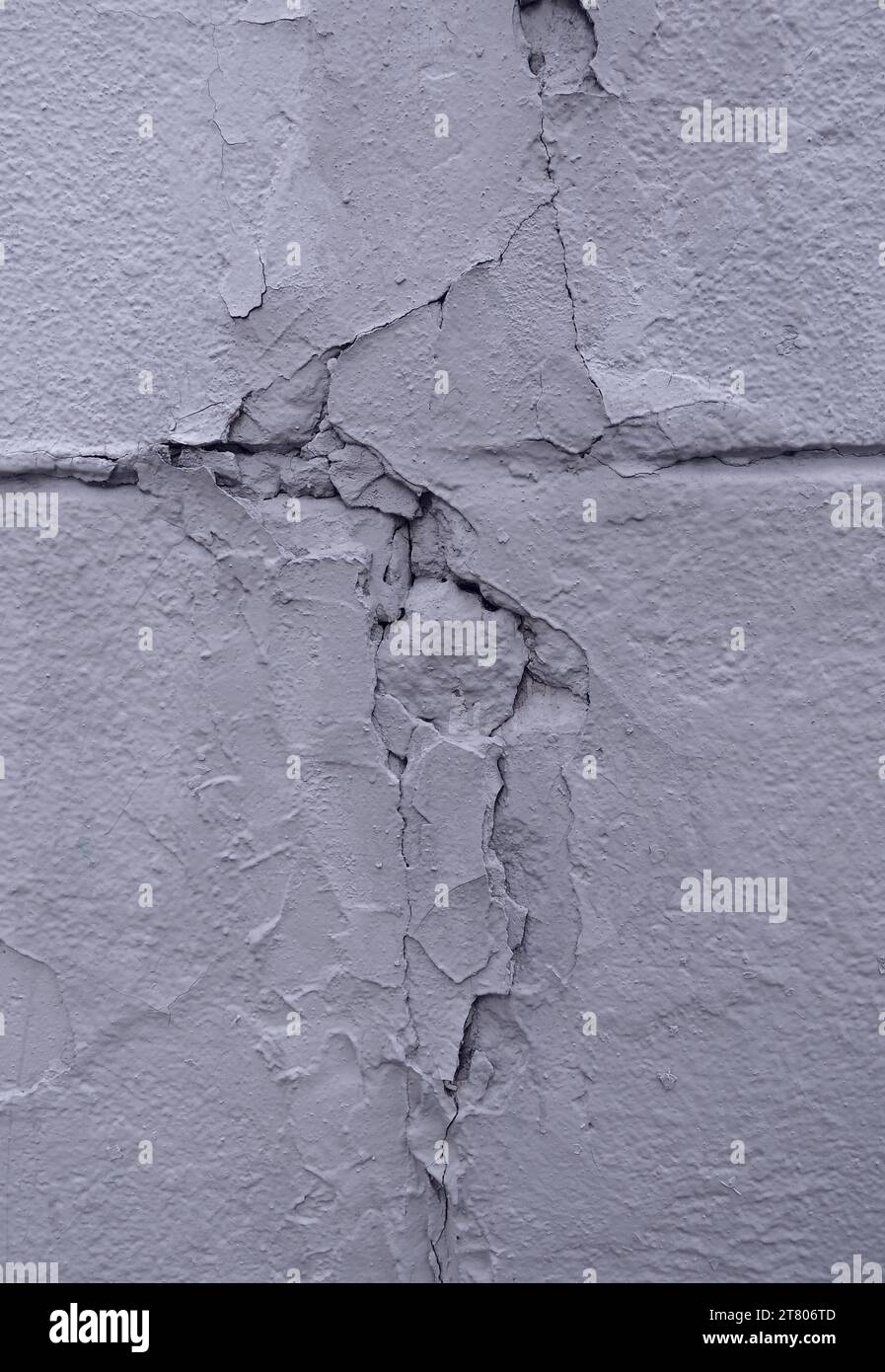 Peeling plaster around a crack between cement slabs Stock Photo - Alamy