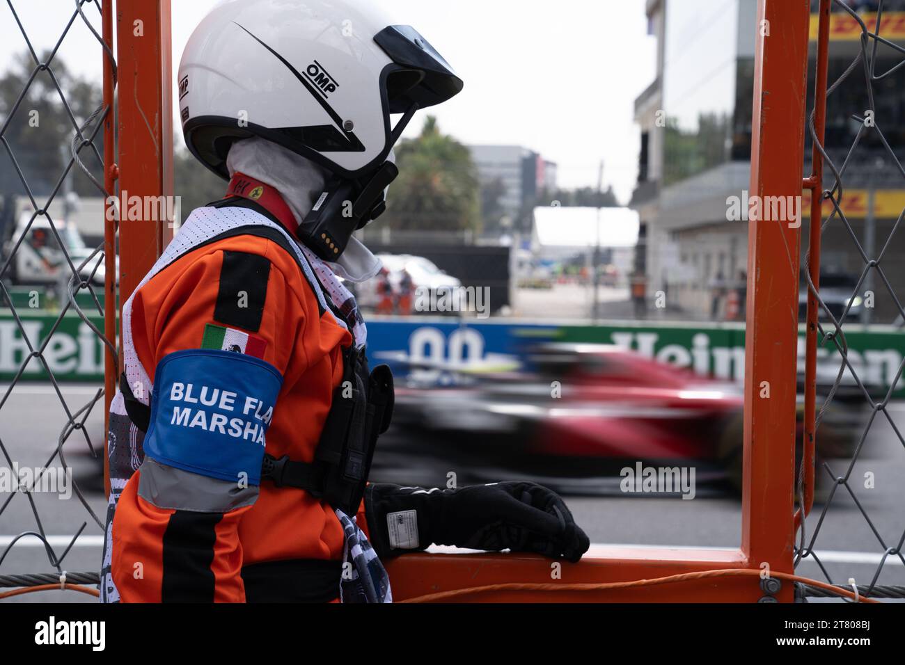 Blue flag marshals tell slower drivers to let cars behind them pass ...