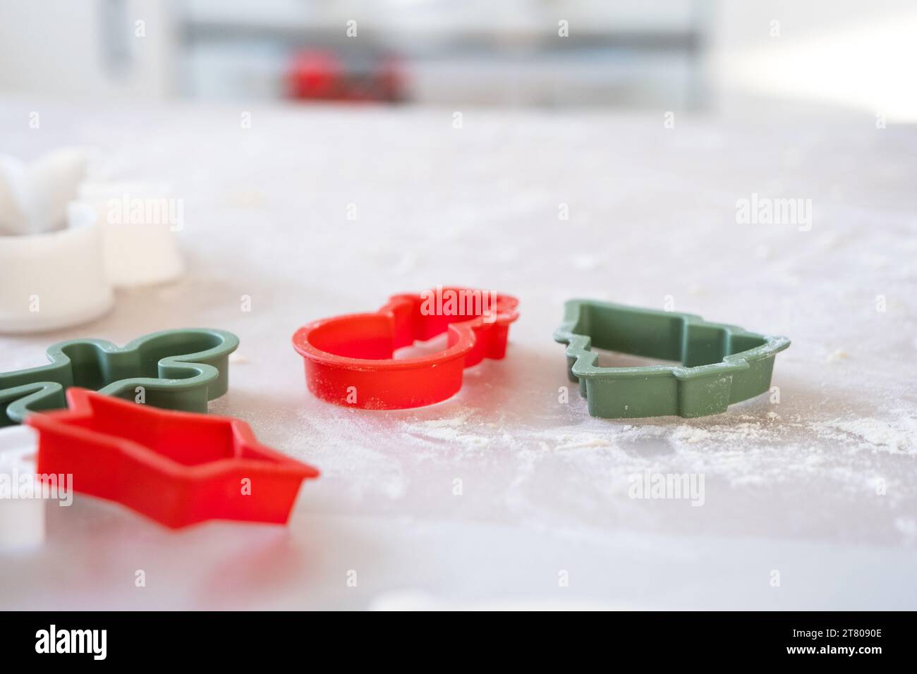 Layout of cookie cutters close-up cut out cookies from the dough with ...