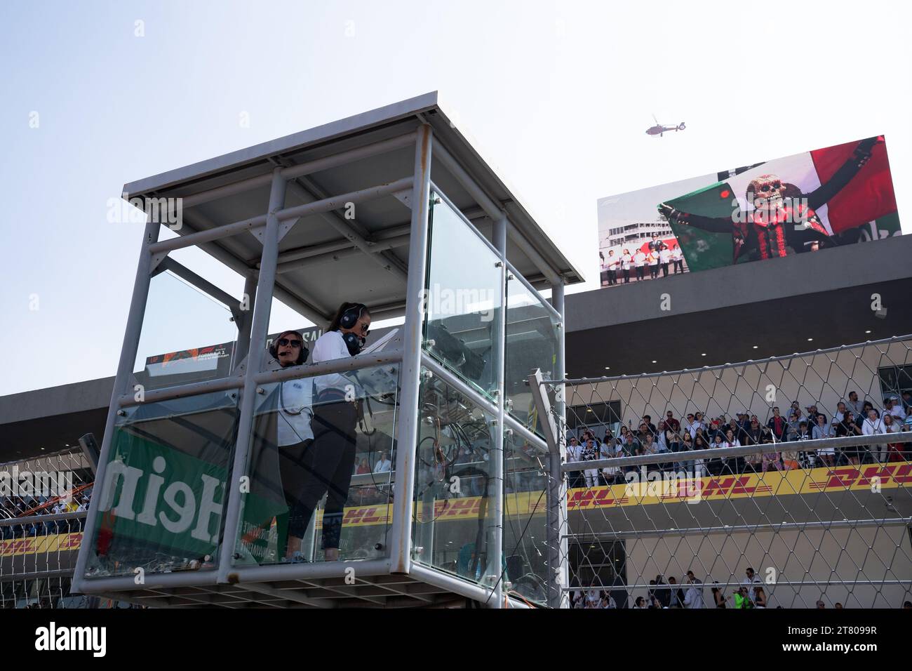 Two officials stand in the tower above the starting grid before the F1 ...