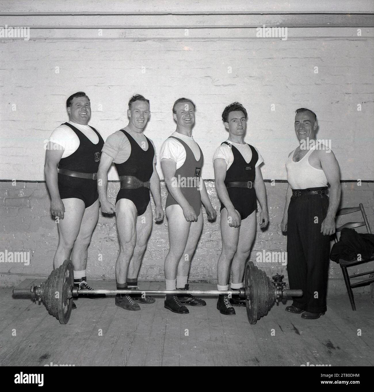 1965, historical, four adult male weight lifters with coach, England ...