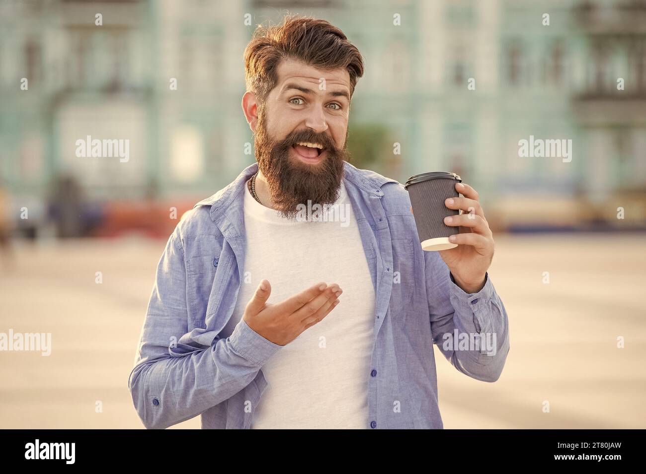 guy offering coffee outside, presenting. guy offering coffee in the ...