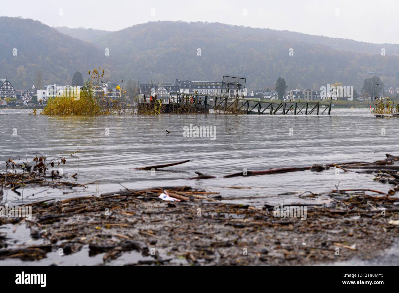 A floating dock is seen behind out of focus debris consisting mostly of ...