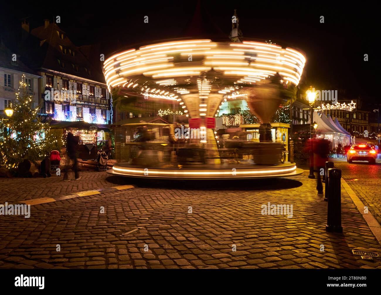 Rotating carousel with illumination in the evening, France Stock Photo ...