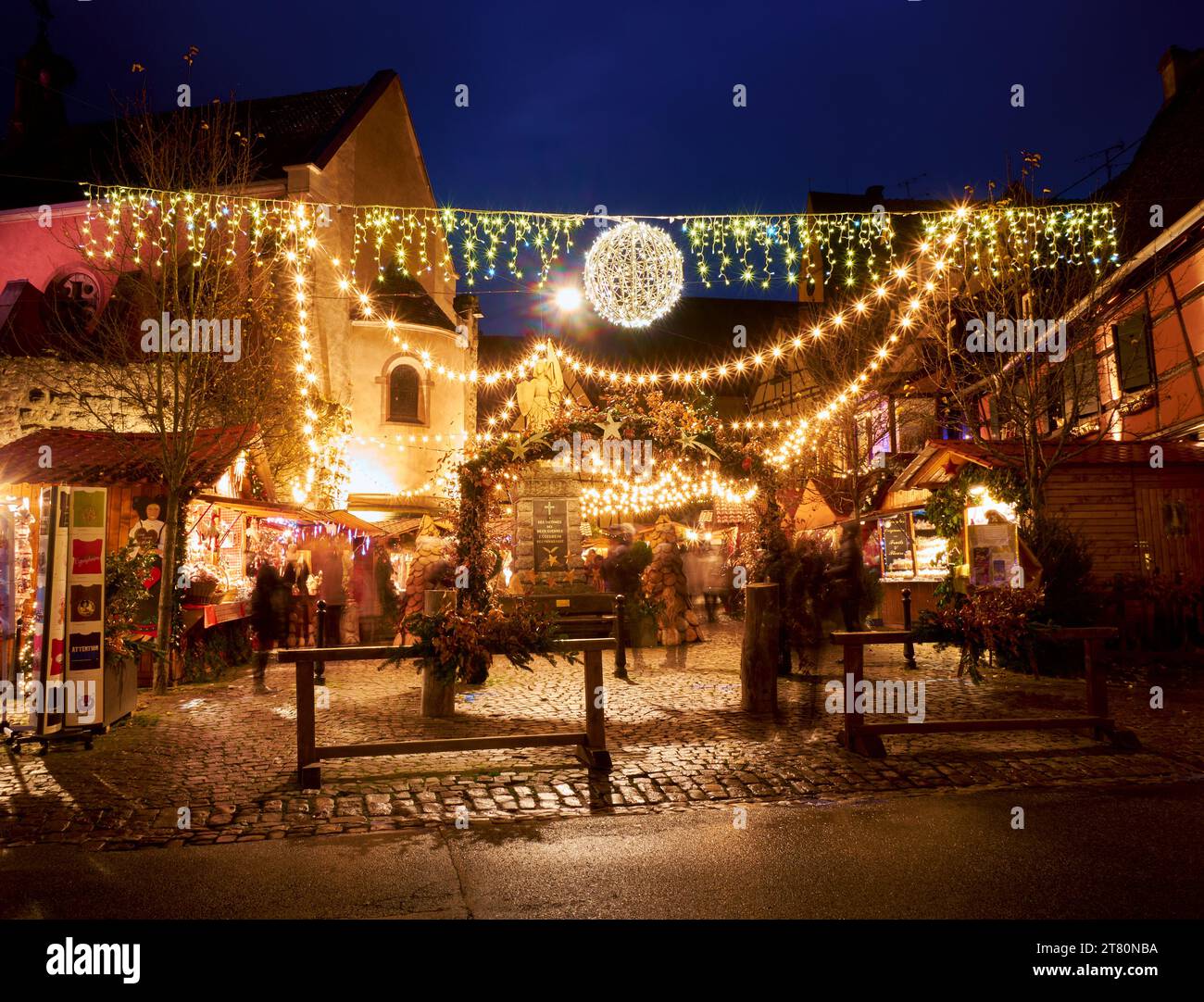 Christmas market with evening illumination in Eguisheim town in Alsace ...