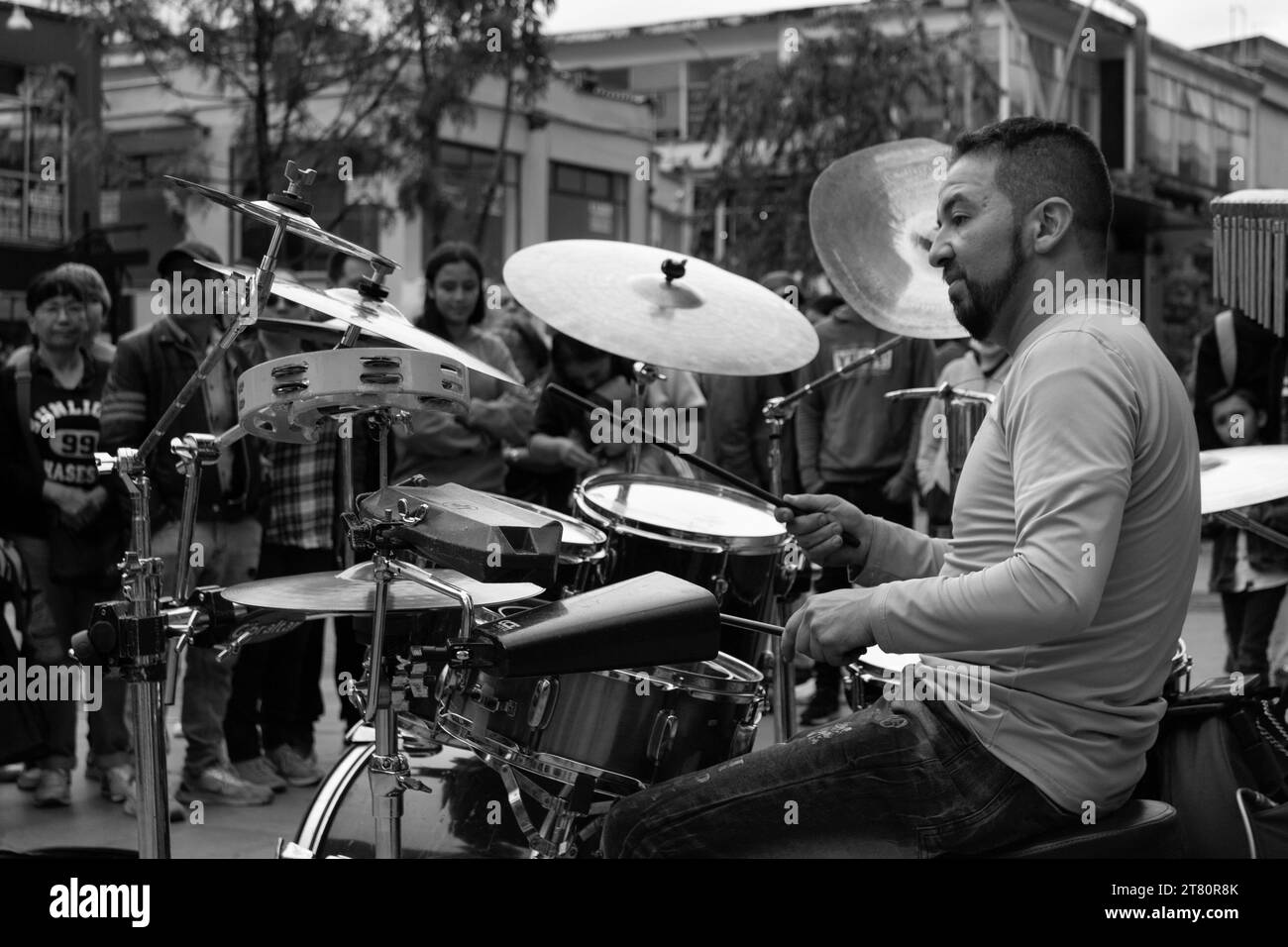 white and black photography of a street drummer at bogota downtown ...