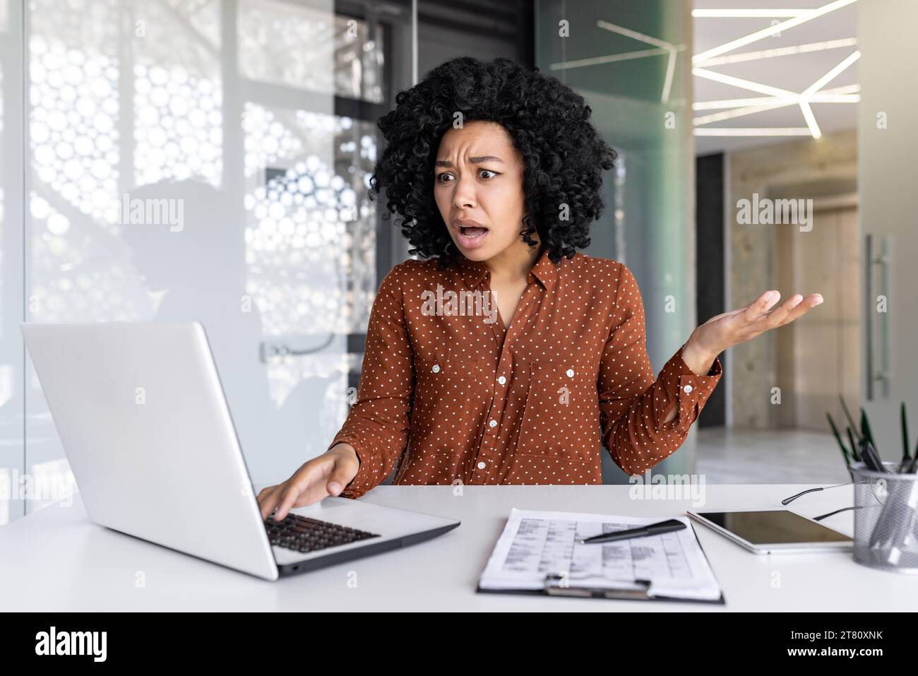 Disappointed young female employee reading hi-res stock photography and ...