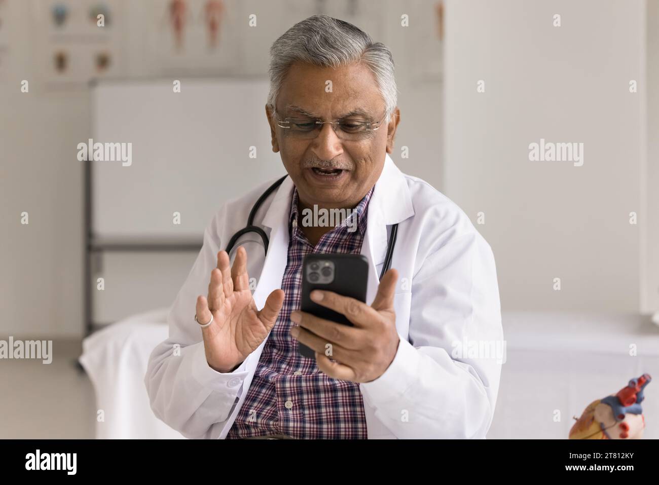 Indian old man talking on phone hi-res stock photography and images - Alamy