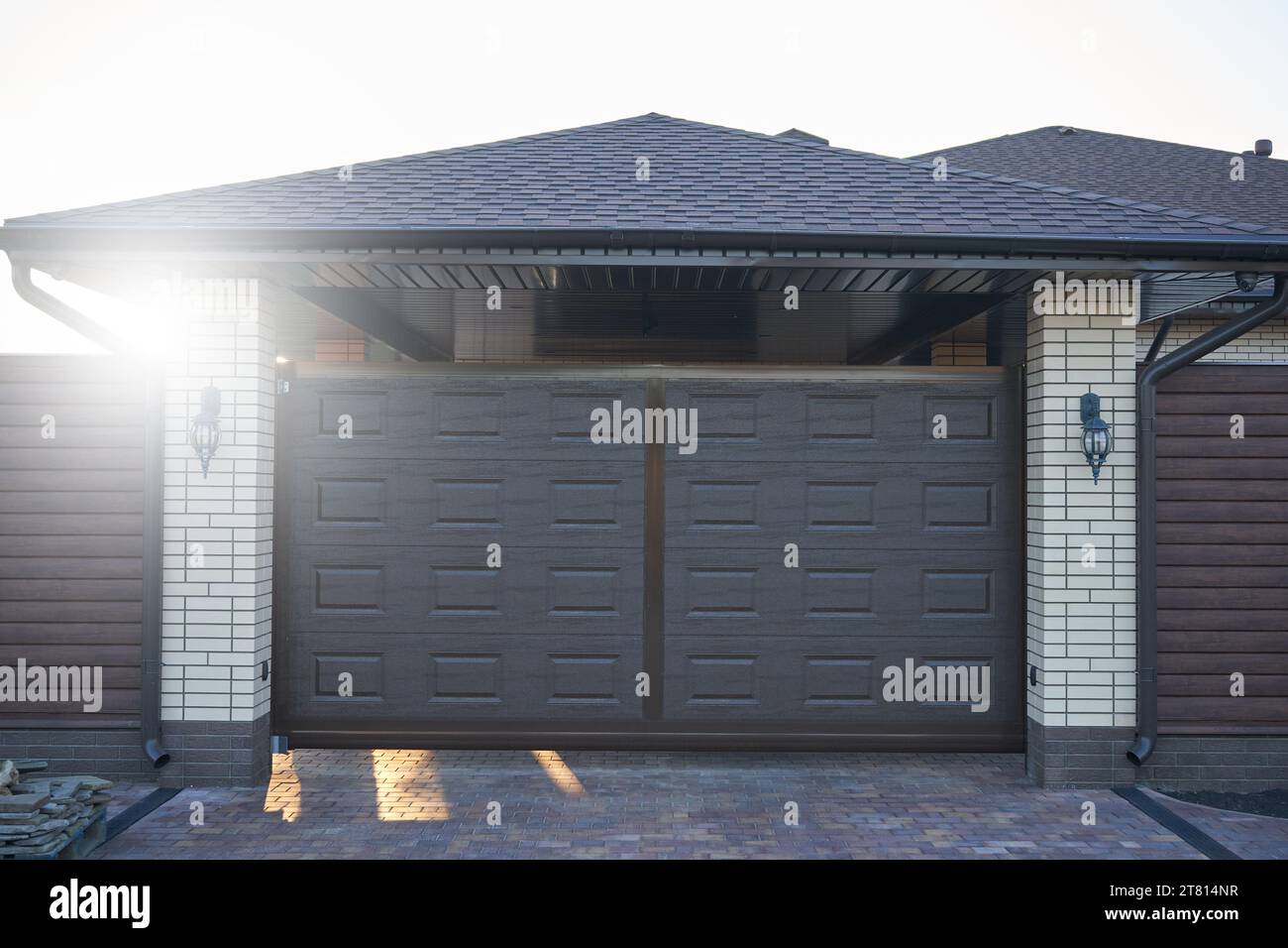Modern side sliding gates with canopy Stock Photo - Alamy