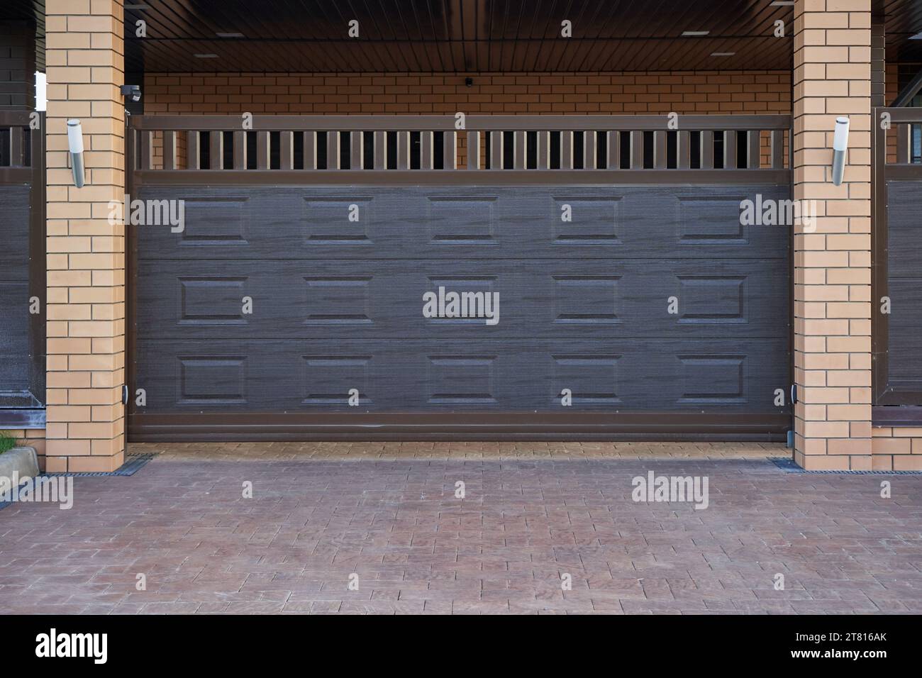 Modern side sliding gates in a private house Stock Photo - Alamy