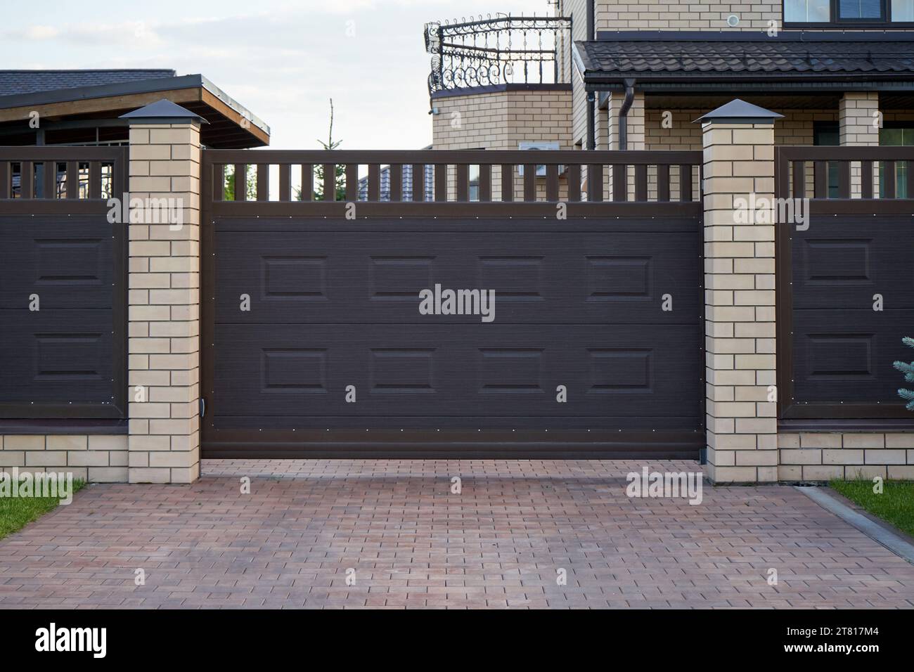 Modern side sliding gates with canopy Stock Photo - Alamy