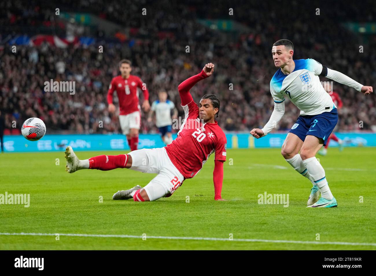 England's Phil Foden, right, challenges for the ball with Malta's ...
