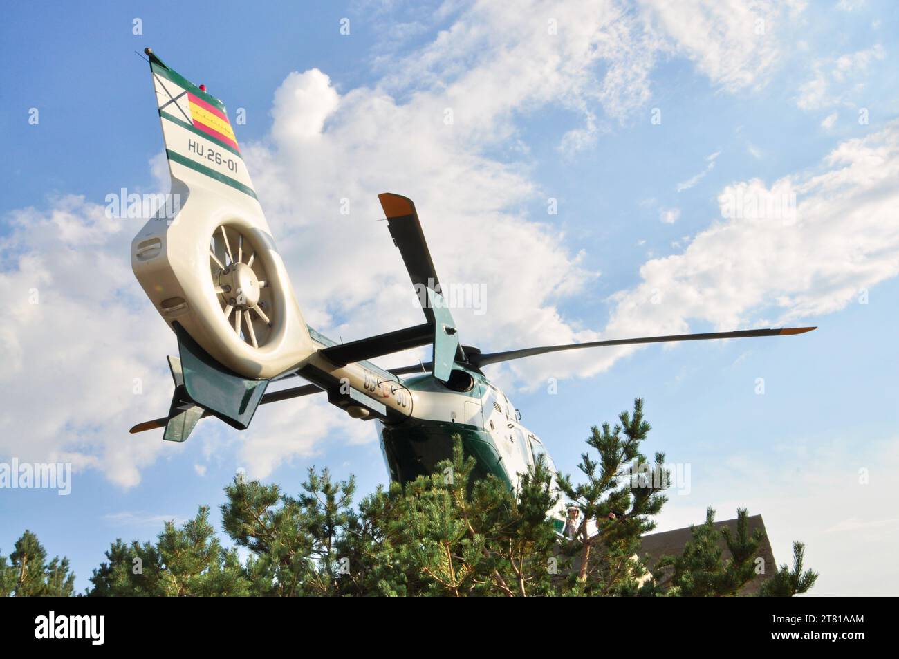 A detailed shot of a Guardia Civil helicopter stationed on the ground ...