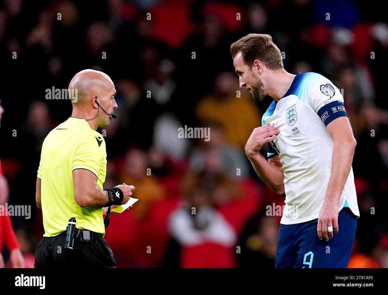 England's Harry Kane speaks to referee Luis Godinho after being shown a ...