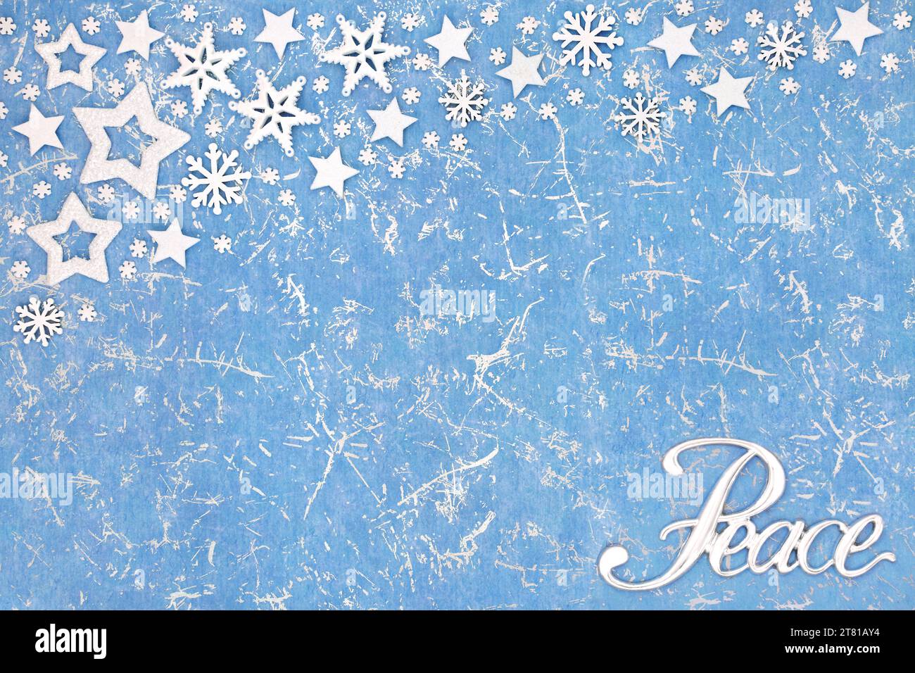 Peace on earth at Christmas abstract background on mottled blue with ...