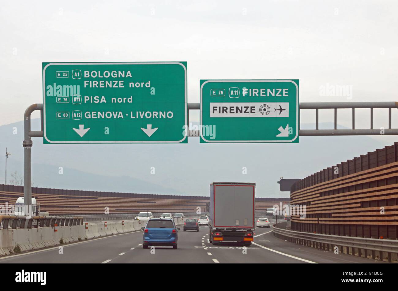 road sign with the crossroads to reach the Italian towns Bologna ...