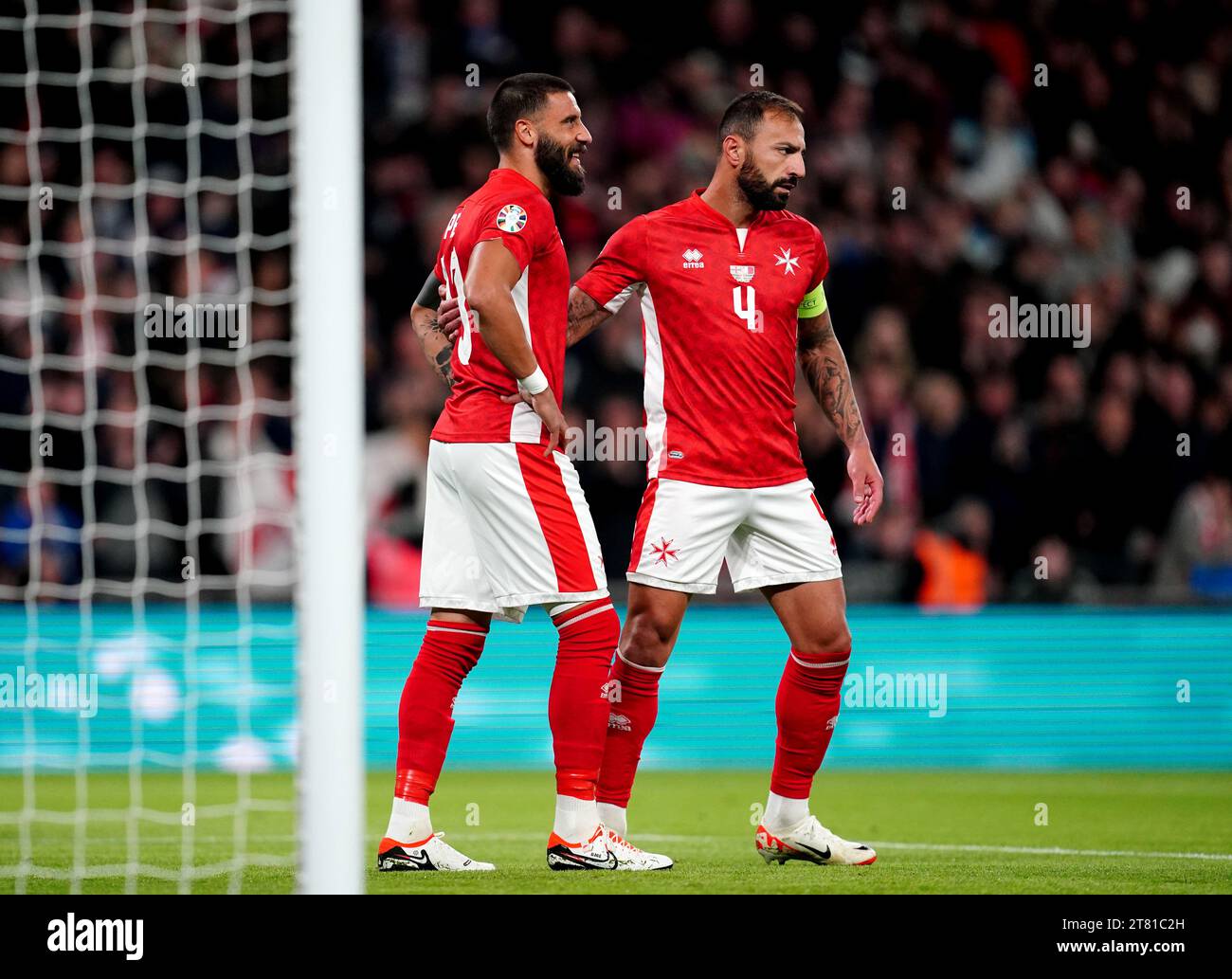 Malta's Enrico Pepe (left) is comforted by team-mate Steve Borg after ...
