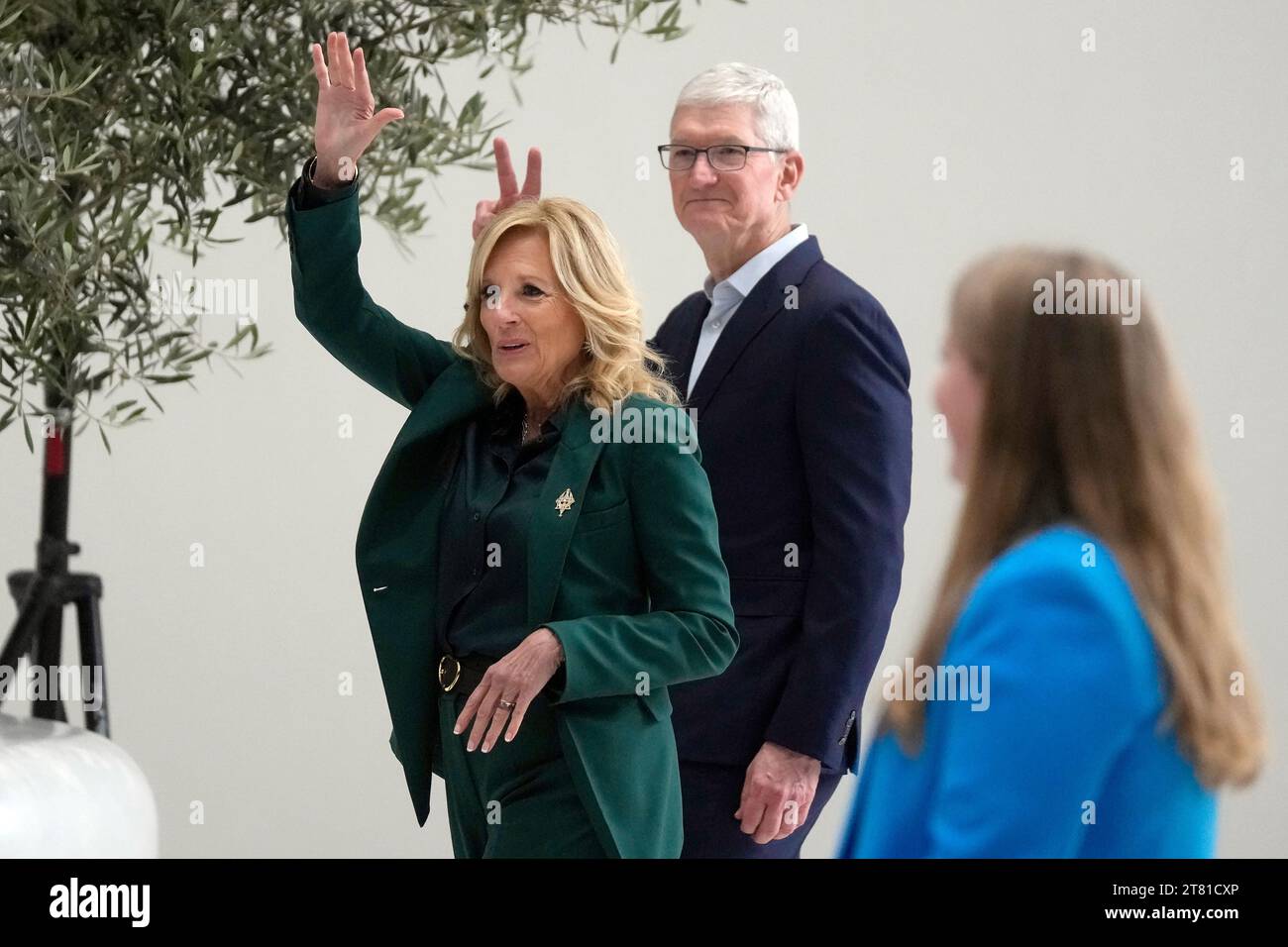 First lady Jill Biden, left, and Apple CEO Tim Cook wave before ...