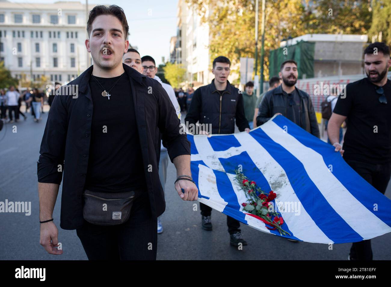 Athen, Greece. 17th Nov, 2023. Students carry a Greek national flag ...