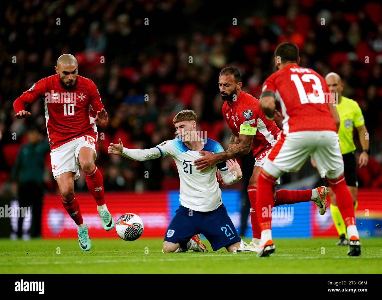 England's Cole Palmer (centre) is fouled by Malta's Steve Borg during ...
