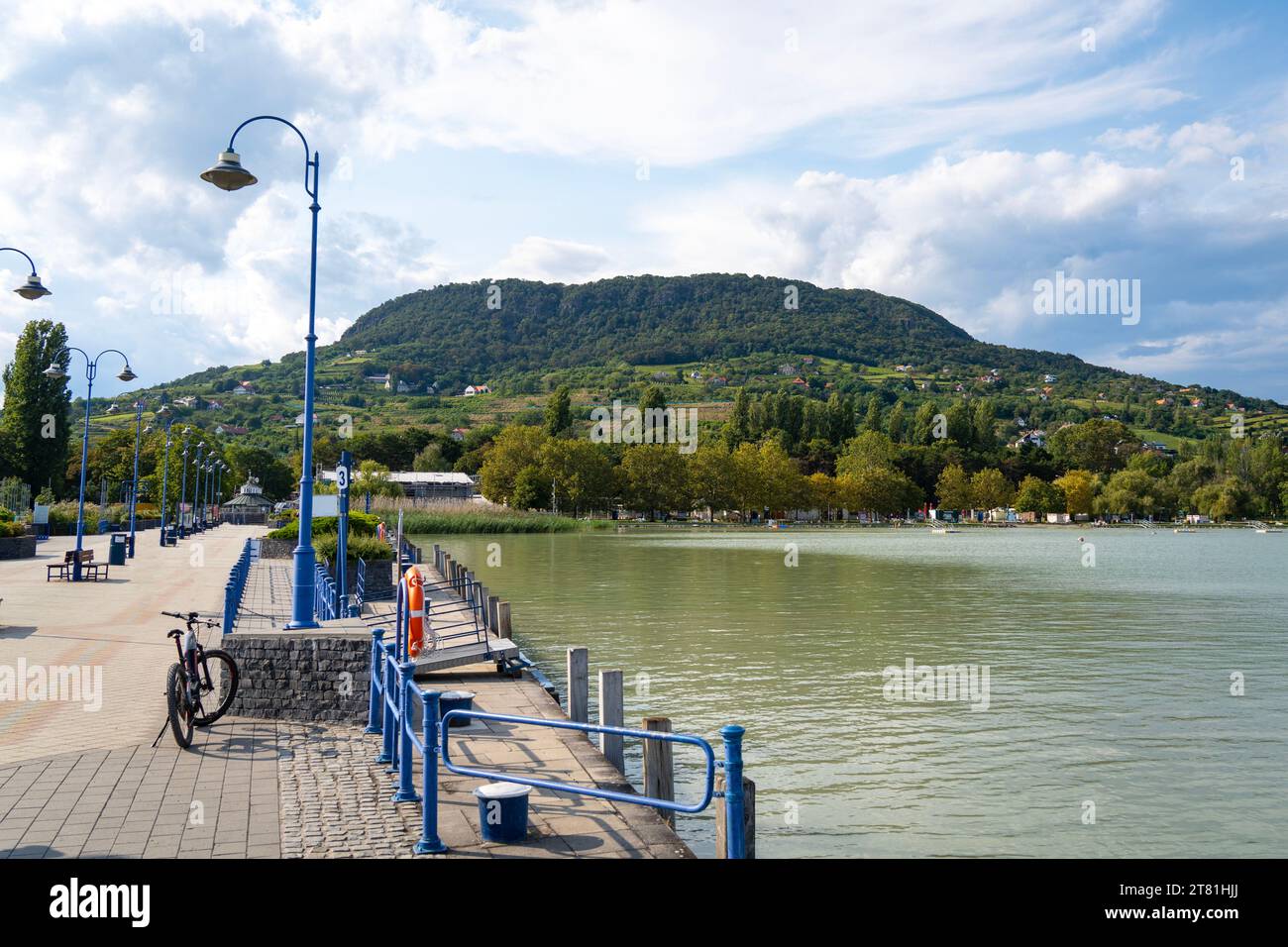 Summer Lake Balaton landscape with a harbor pier and Badacsony Hill and ...
