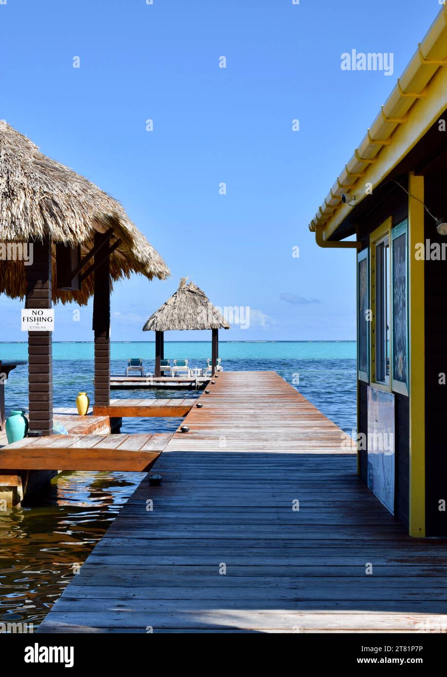 A pier with palapas at X'tan Ha beach resort on north Ambergris Caye ...