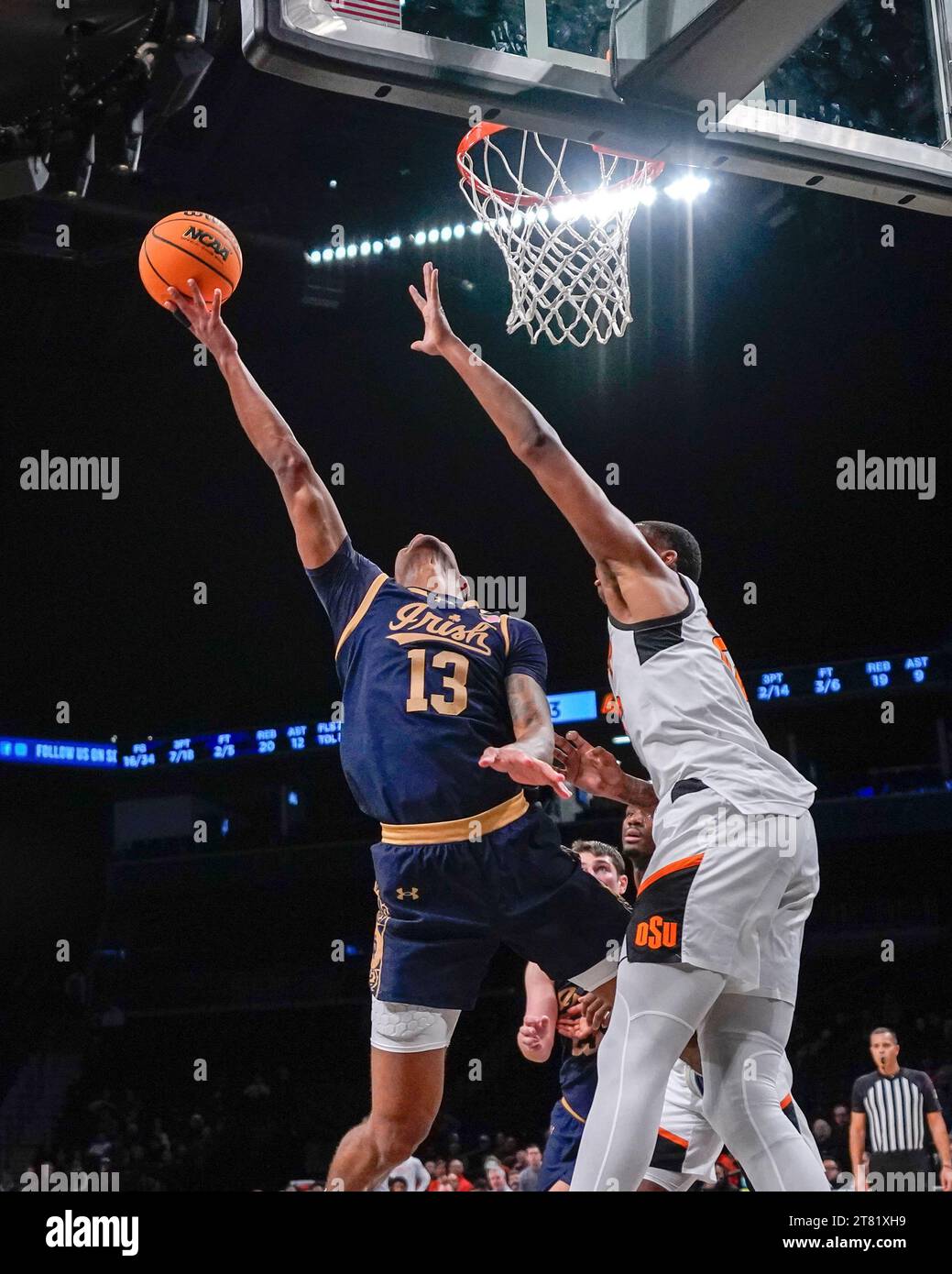 Notre Dame forward Tae Davis shoots over Oklahoma State center Brandon ...
